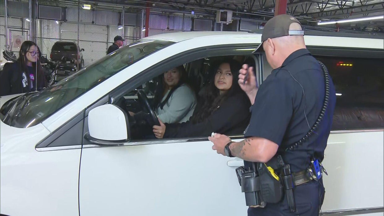 Denver police officers meet with students to discuss traffic safety ...