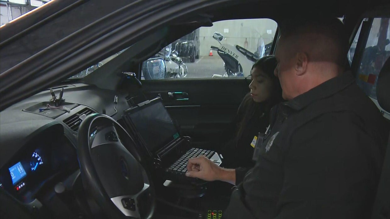 Denver police officers meet with students to discuss traffic safety ...