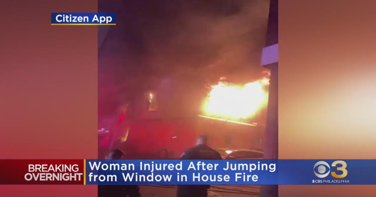 Woman hurt after jumping from window during house fire in Northeast ...