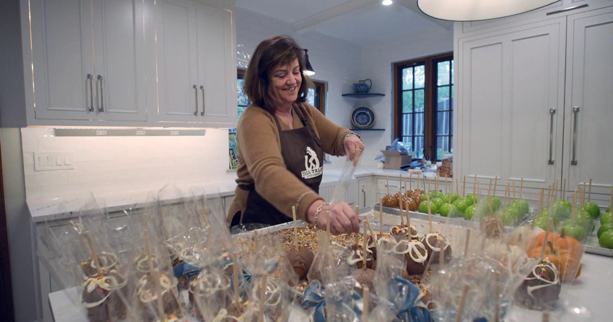 Denver woman raises thousands for charity selling candy apples - CBS News