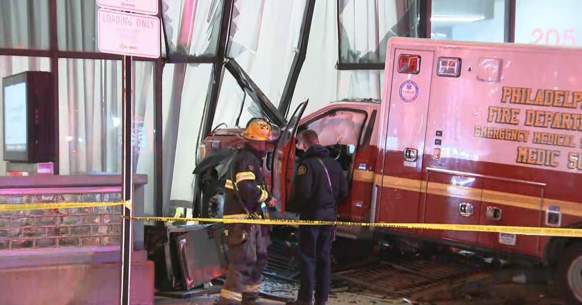 Ambulance crashes into building after two-vehicle crash - CBS Philadelphia