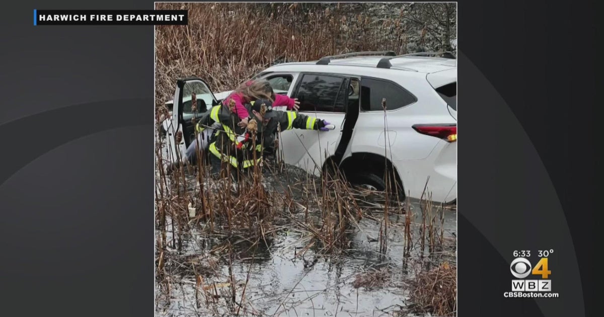 Firefighters rescue driver stuck in high water in Dennis - CBS Boston