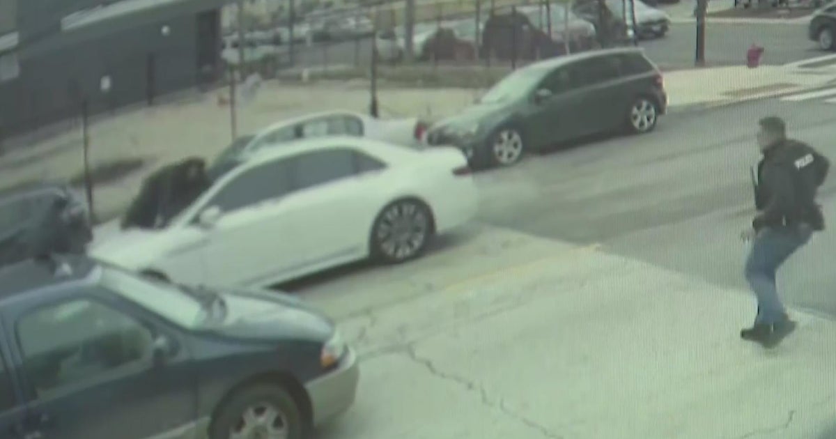 Video shows thief jumping on to car's hood during police chase - CBS ...