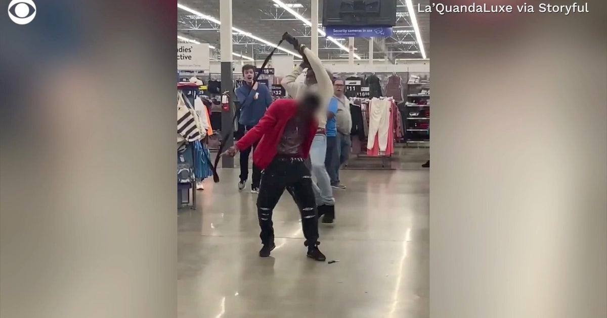 Veteran knocks over knife-wielding man at Walmart - CBS News