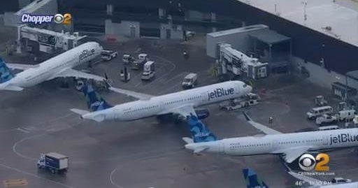JetBlue plane strikes tail of parked plane at JFK Airport - CBS New York