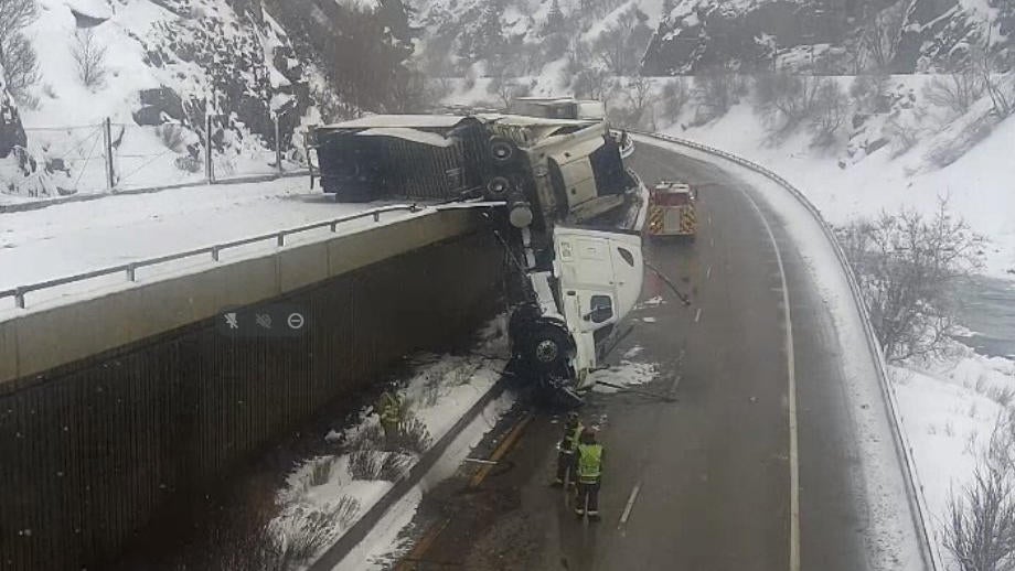 Westbound lanes reopened after tractor-trailer was dangling off ...