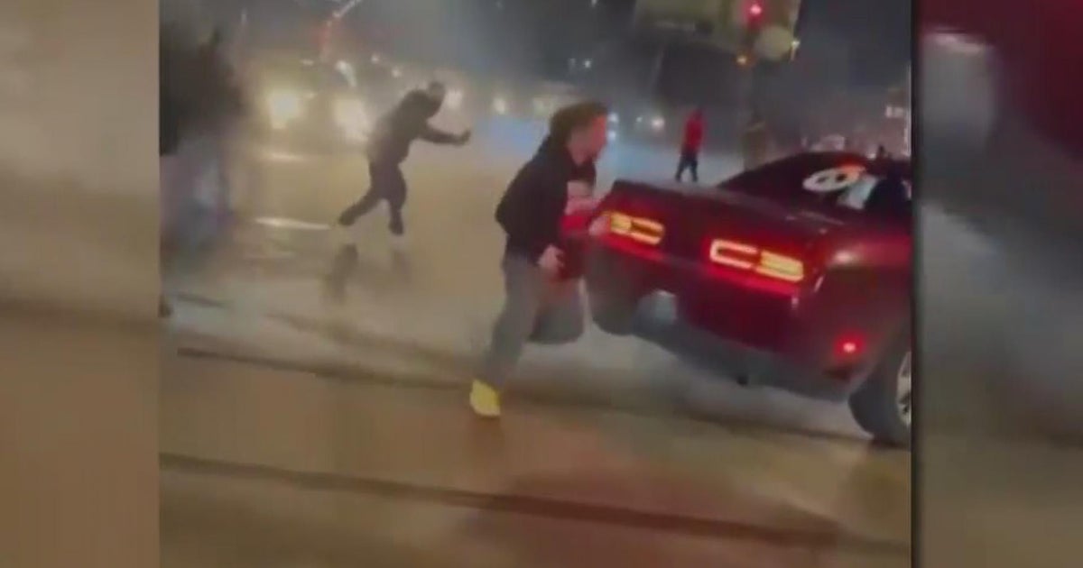 Woman thrown from car, run over in dangerous street takeover - CBS Chicago