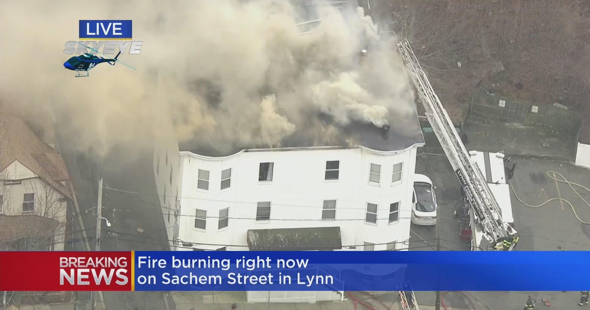 Fire tears through roof of multi-family home in Lynn - CBS Boston