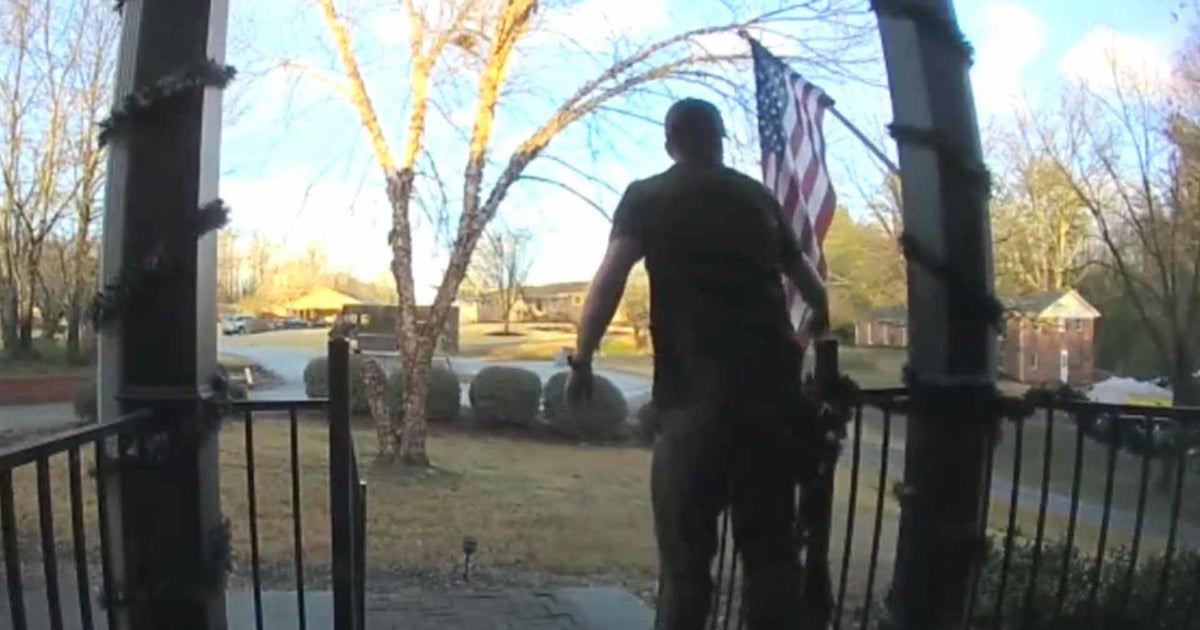 UPS driver stops to fix family's tangled American flag - CBS News
