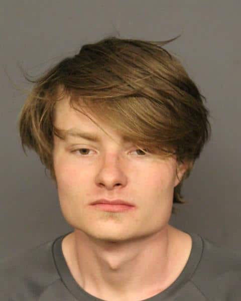 2 arrested in deadly shooting after man's body found in parking lot ...