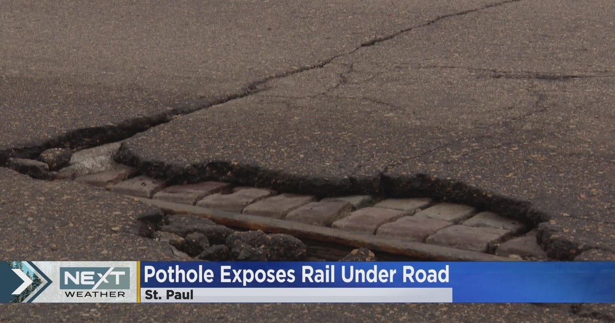 Pothole in St. Paul reveals old street car rail - CBS Minnesota