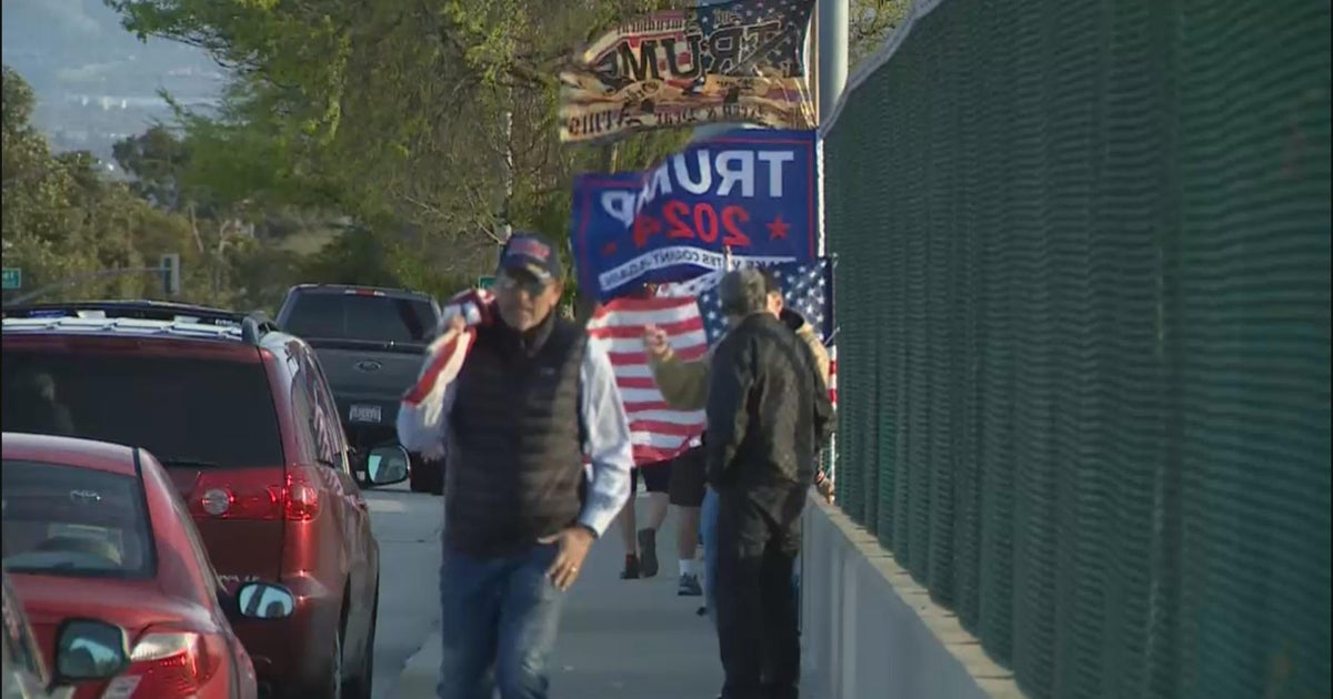 Trump supporters wave American flags over I-210 Freeway in Upland - CBS ...