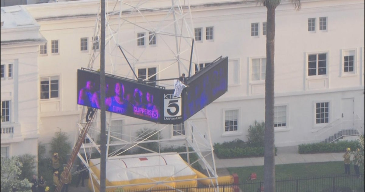 Sunset Blvd shuts down as man climbs up KTLA tower in Hollywood - CBS ...