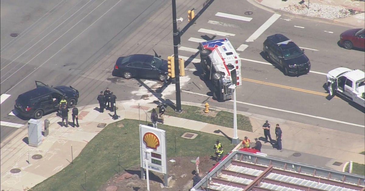 Crash leaves ambulance on its side in Boulder - CBS Colorado