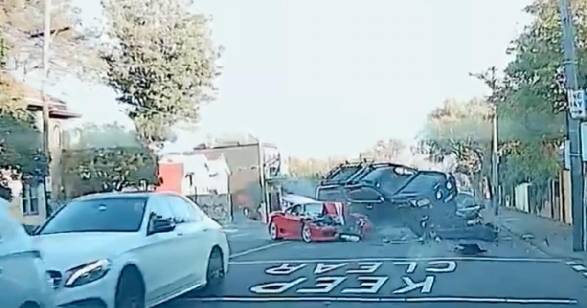 Video shows Ferrari crashing into two cars in Melbourne - CBS News