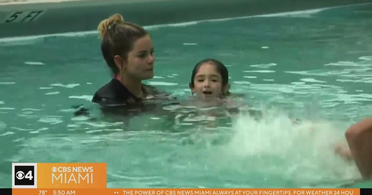 Swim school instructor inspired by childhoold water emergency - CBS Miami