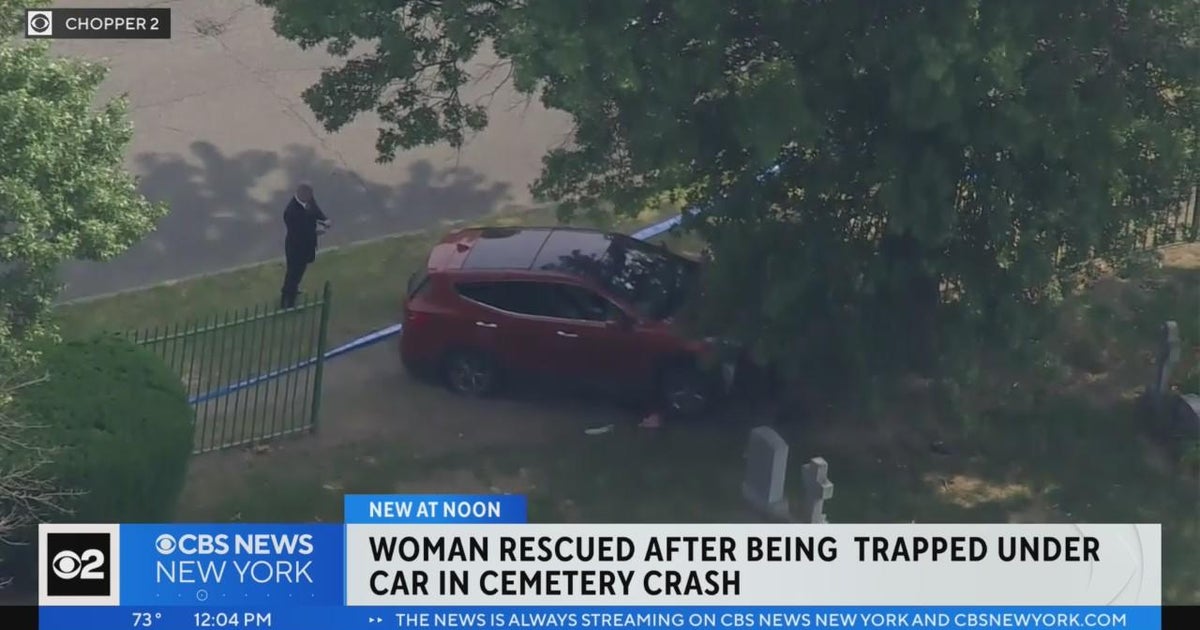 Woman trapped under car after driver crashes through fence in Queens ...