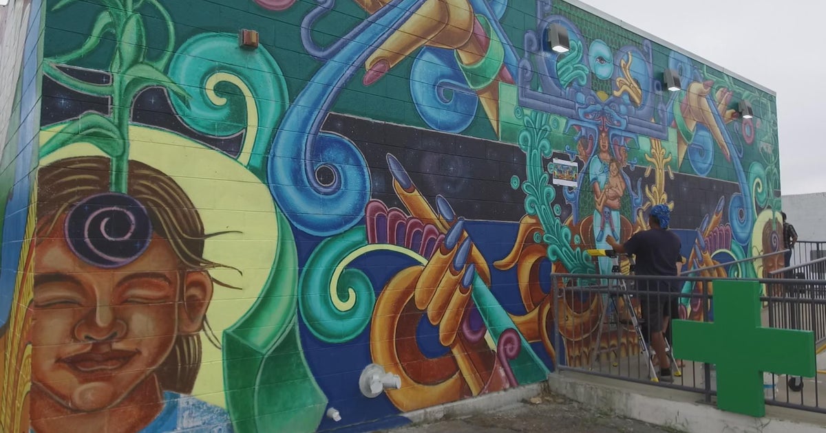 Denver mural, once nearly destroyed, is now nearly restored - CBS Colorado
