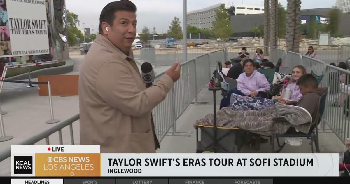 Fans line up for Taylor Swift merchandise on the second SoFi tour day ...