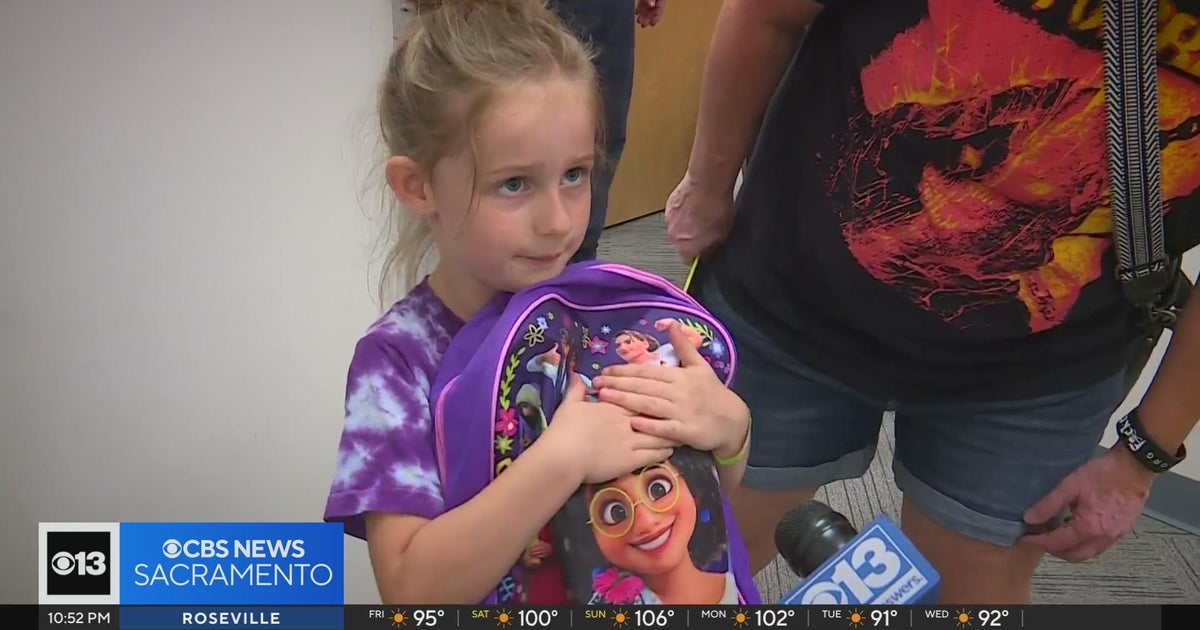 Operation Backpack: Kids pick up their packs loaded with back-to-school ...