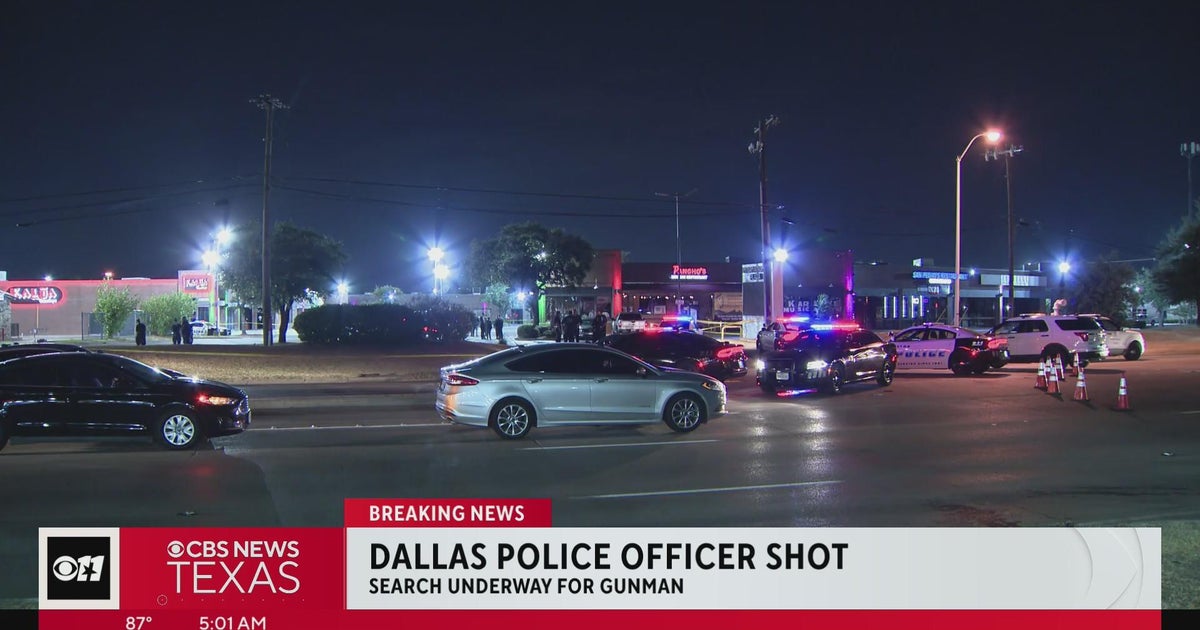 Dallas police officer shot overnight, search underway for gunman - CBS ...