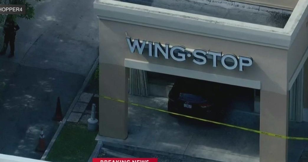Police investigating after car smashes into Miami Wingstop - CBS Miami