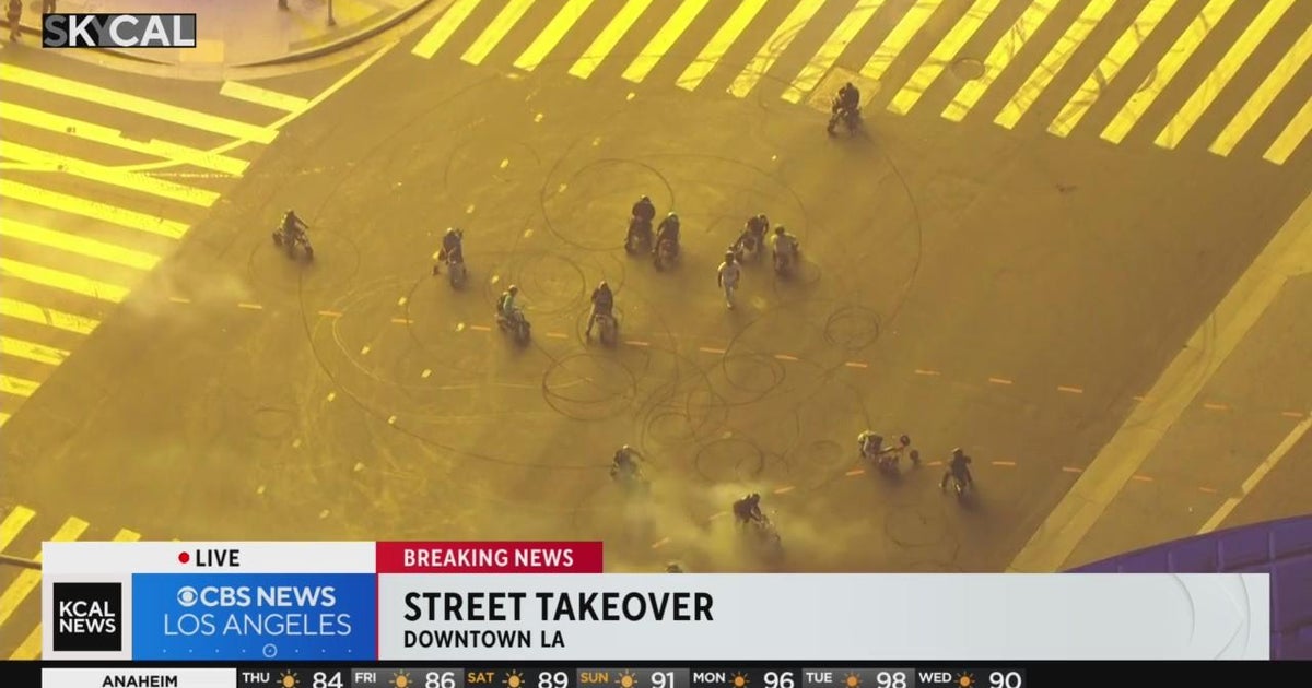 Motorbikes take over a street in downtown LA - CBS Los Angeles