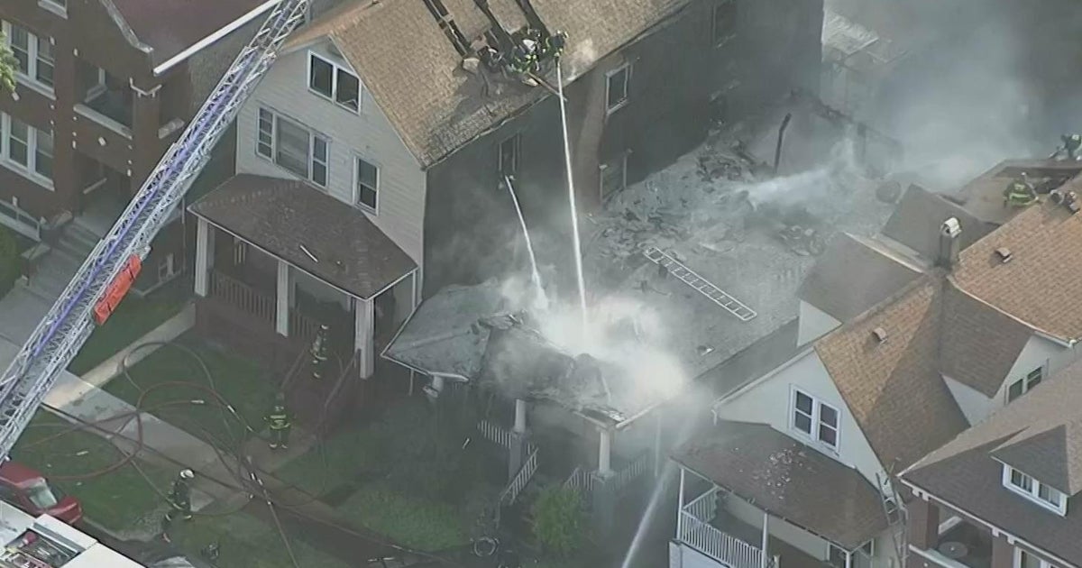 Crews battle fire that spread to 3 Chicago Lawn buildings - CBS Chicago