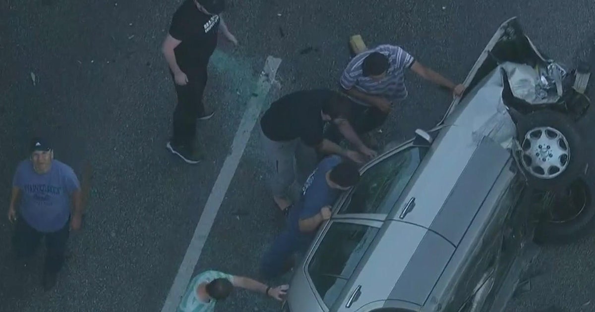 Good Samaritans Leap In After Car Flips On Side On Dusable Lake Shore
