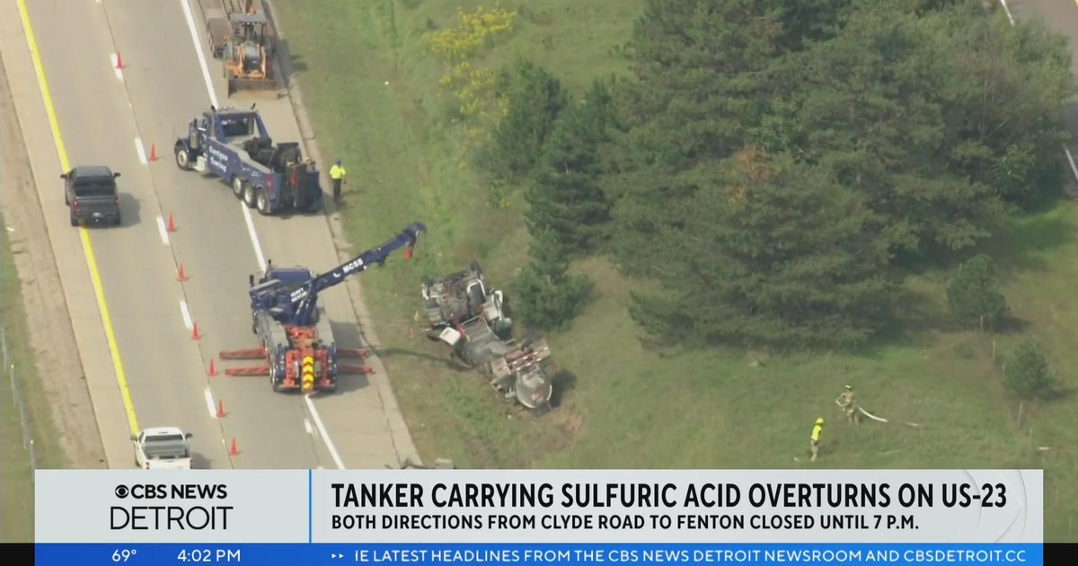 Tanker carrying sulfuric acid overturns on US-23 - CBS Detroit