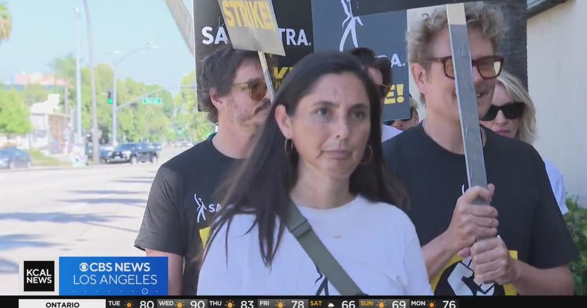 Actors continue to march as writers comb over tentative deal - CBS Los ...