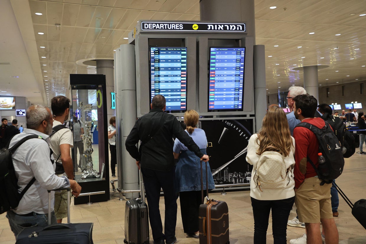 Major airlines halt flights to Israel after Hamas attack - CBS News