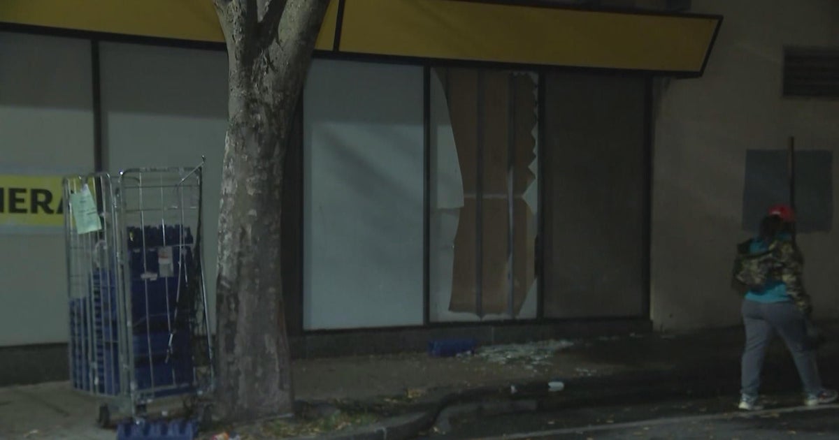 Police officer thrown into glass window at Upper Darby store - CBS ...