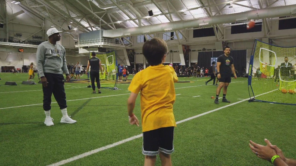 Deion Sanders sets Guinness World Record for largest American football ...