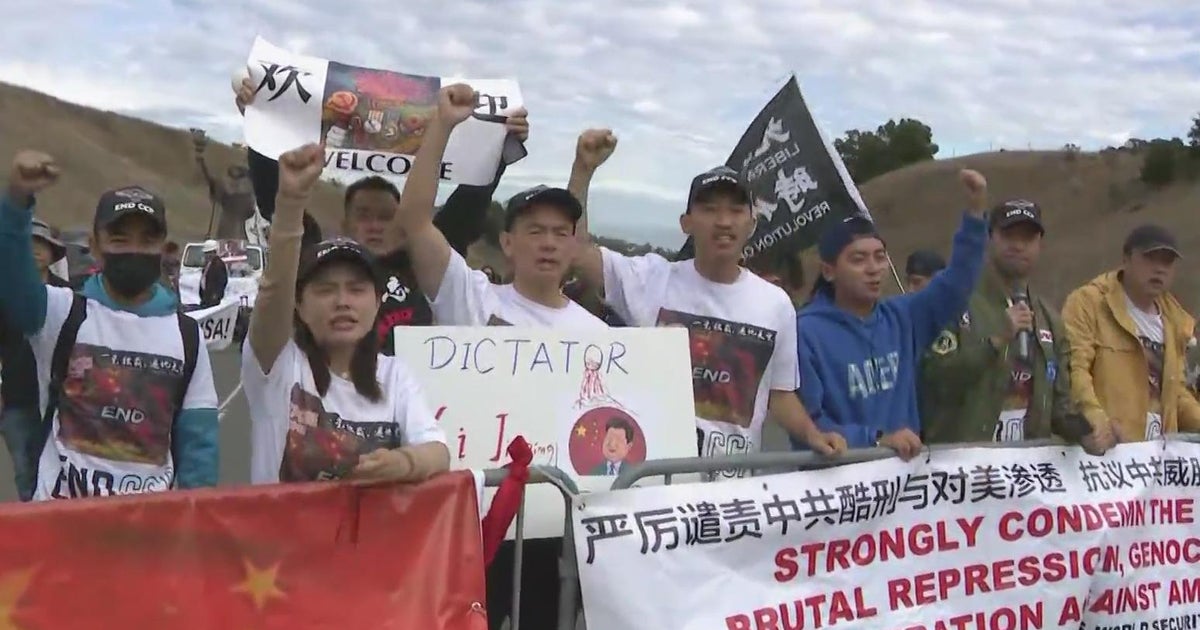 Protesters hold dueling demonstrations on road to Biden / Xi meeting in ...