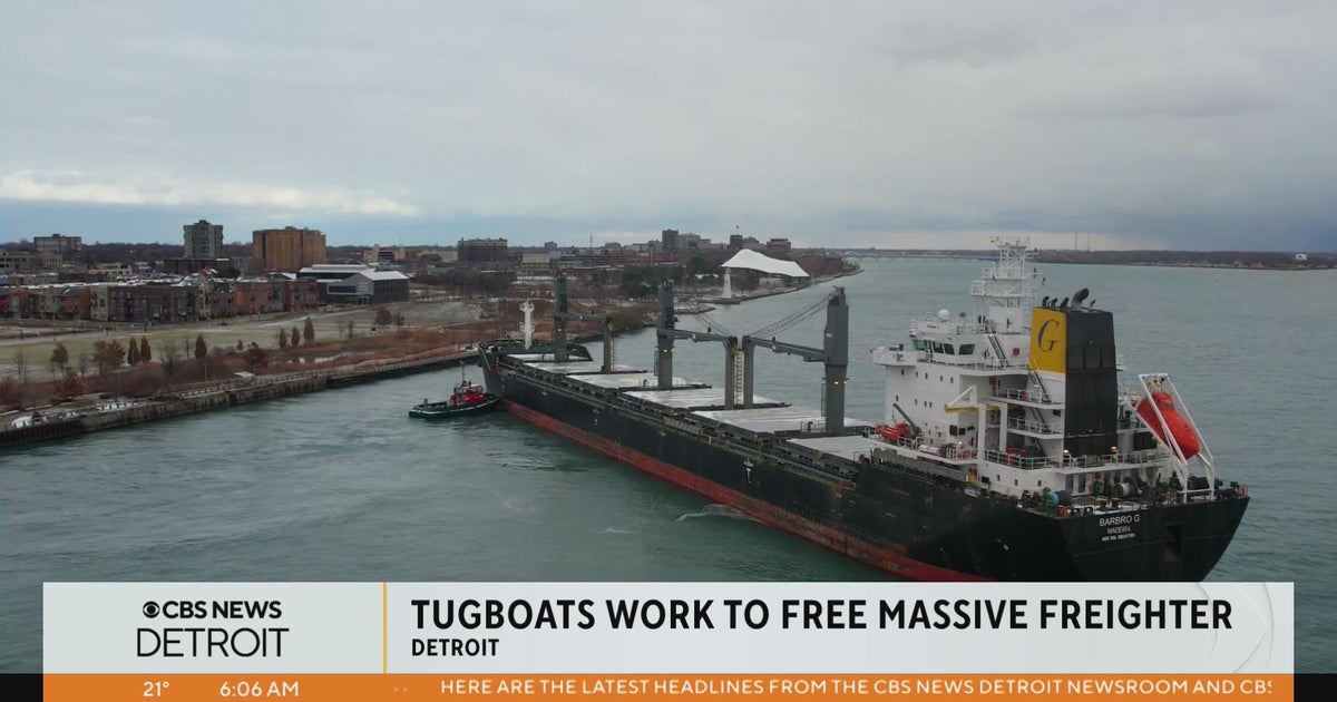 Tugboats work to free massive freighter from Detroit River - CBS Detroit