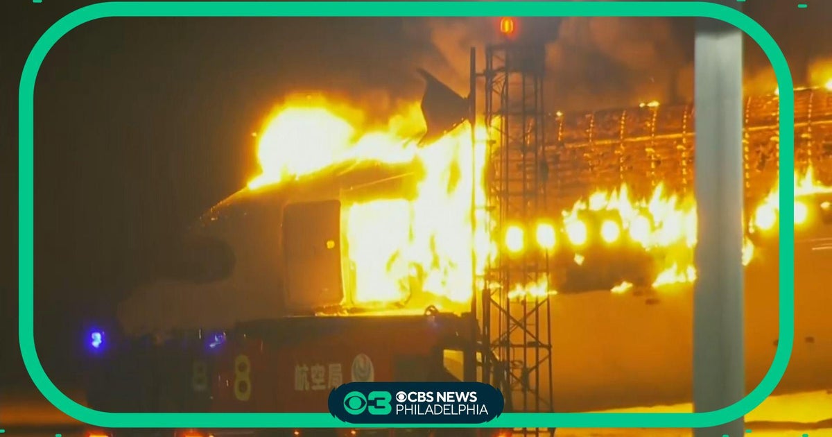 Plane catches on fire after landing at Haneda Airport in Tokyo, Japan ...