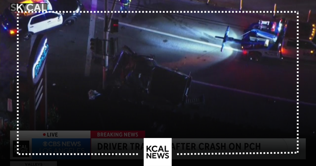 PCH collision traps driver inside car - CBS Los Angeles
