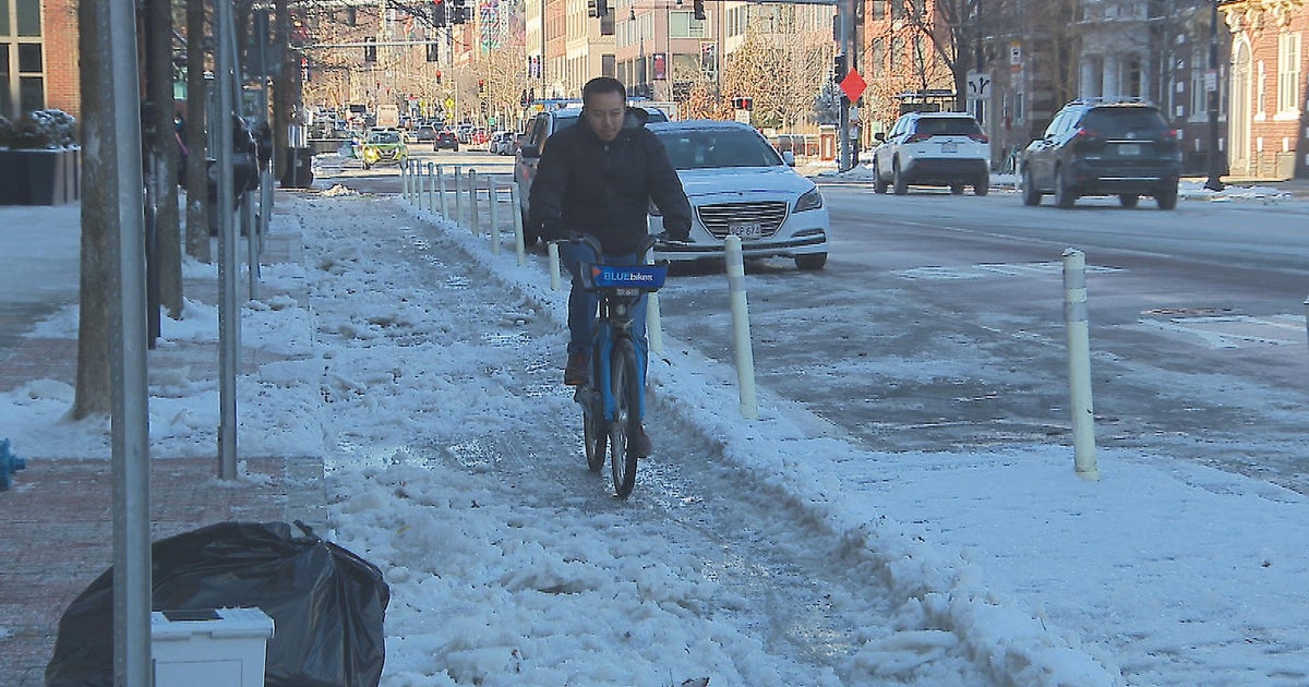 Snow and ice covered bike lanes in Cambridge force some riders to use ...