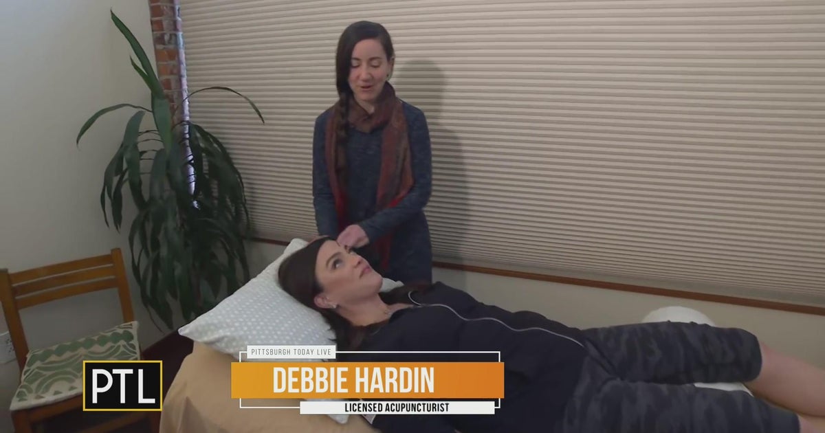 Checking with Katie during her acupuncture appointment at Hardin ...