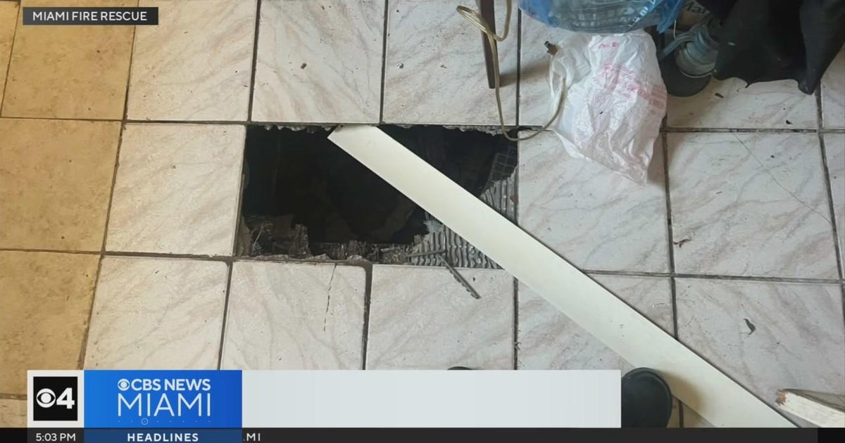 Elderly woman falls through floor of her residence - CBS Miami