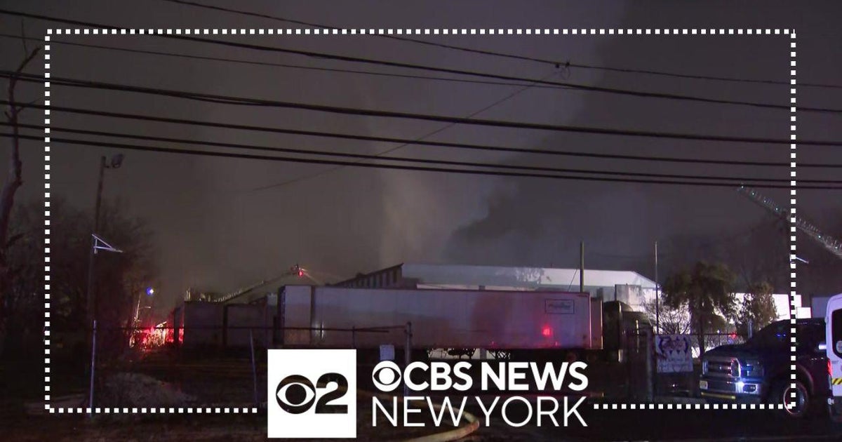 Firefighters continue battling mattress warehouse fire in North ...