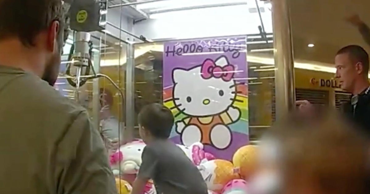 Officers rescue 3-year-old boy who got stuck in claw machine - CBS News