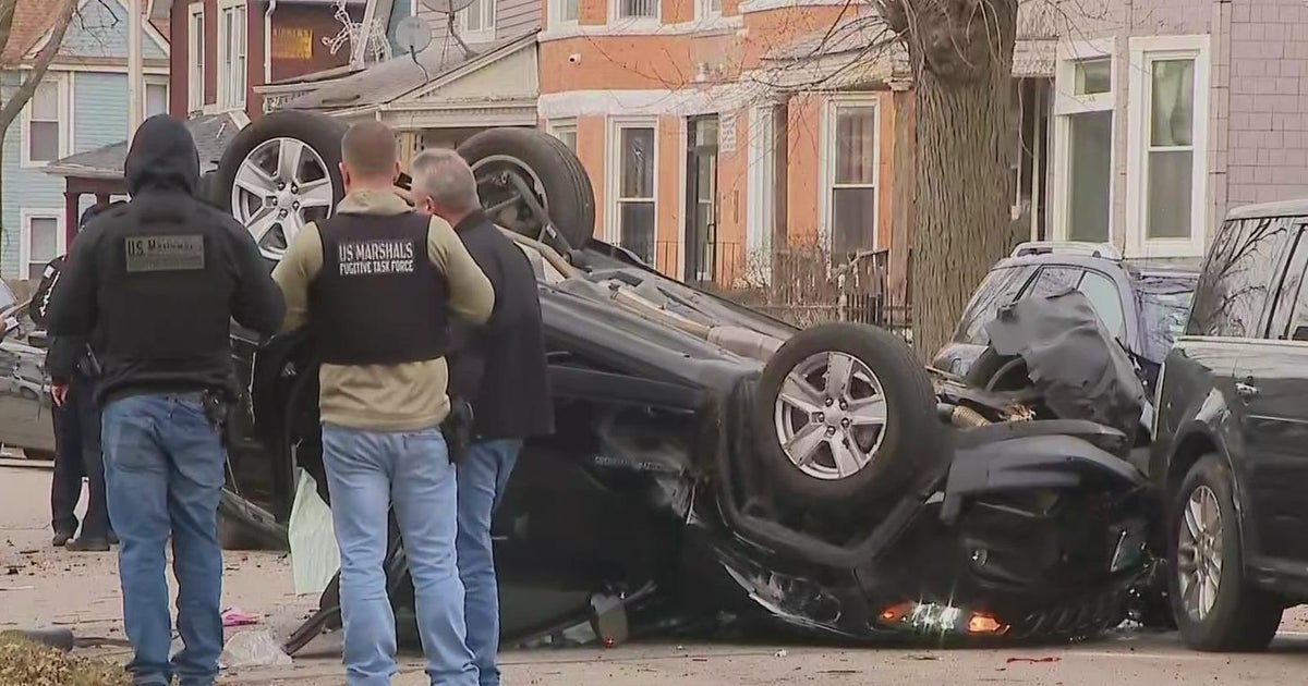 Car flips over after crash on Chicago's South Side - CBS Chicago