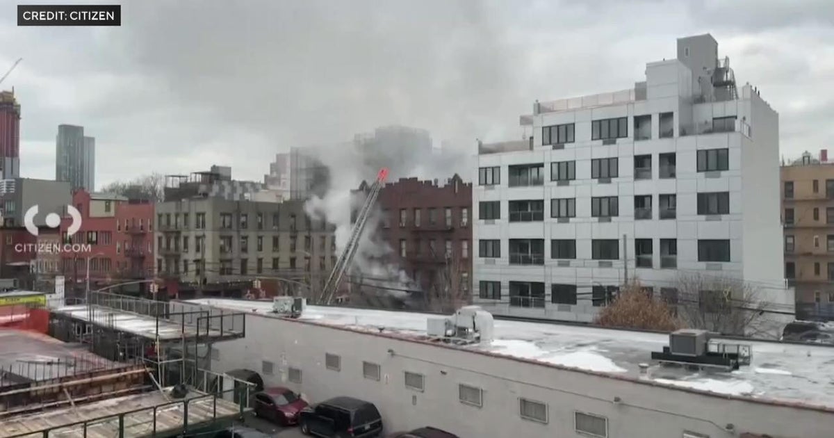 Fire burns through Astoria, Queens building - CBS New York