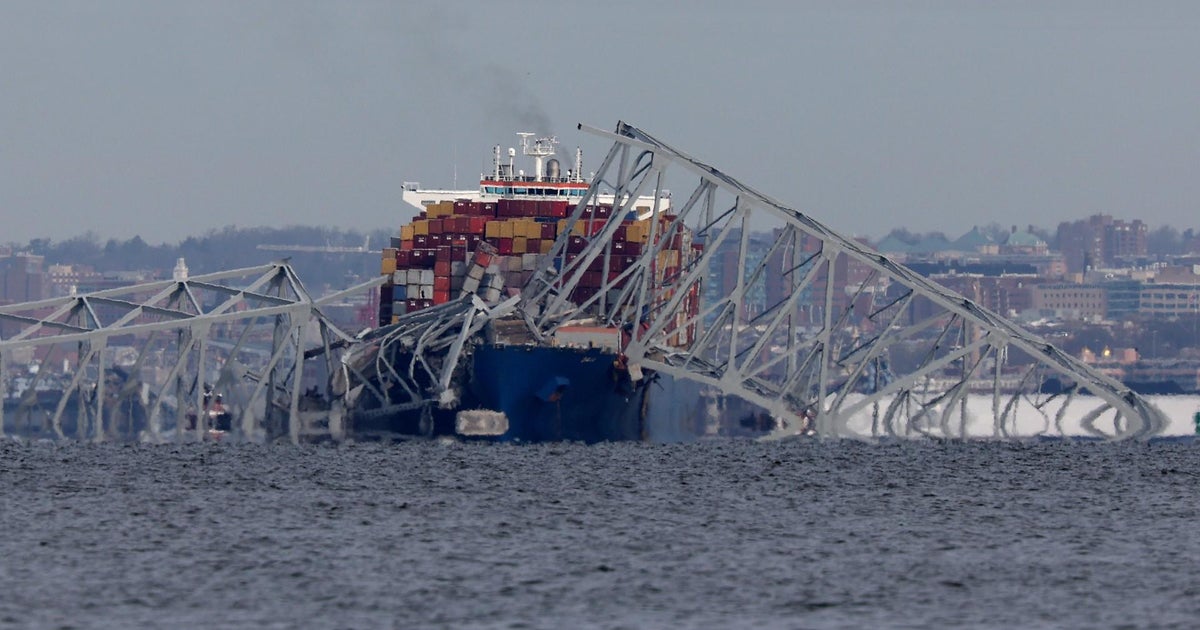 Baltimore bridge collapses into river after cargo ship crash; 2 people ...