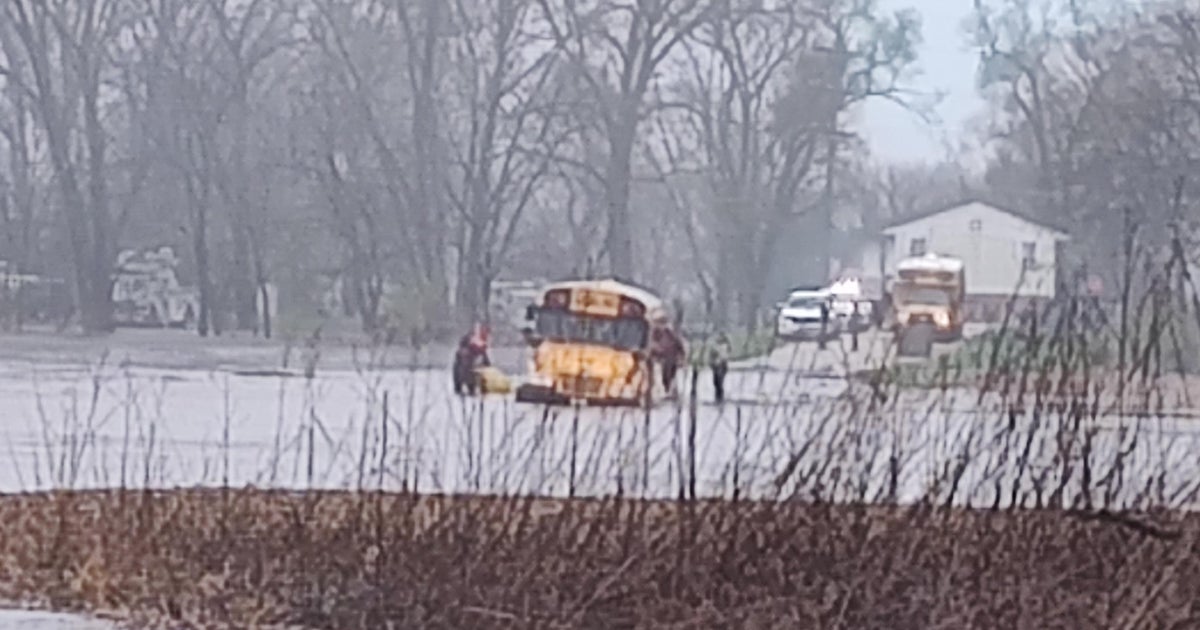 Special needs students rescued from school bus stuck in flood in ...