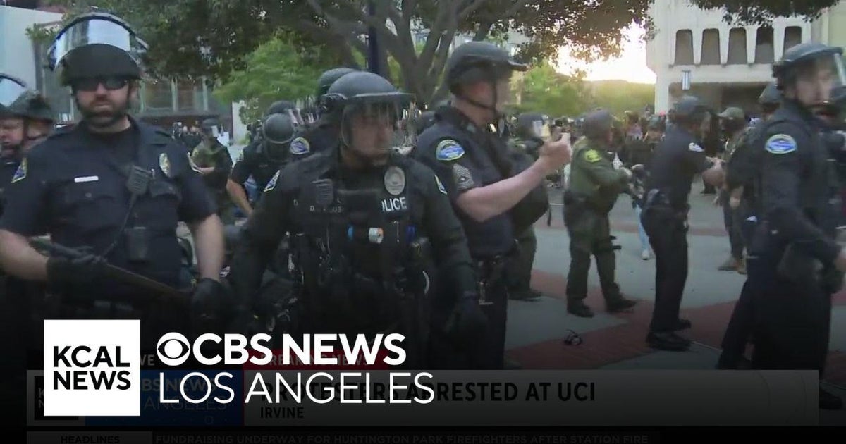 Demonstrators stop to pray during UCI protests - CBS Los Angeles