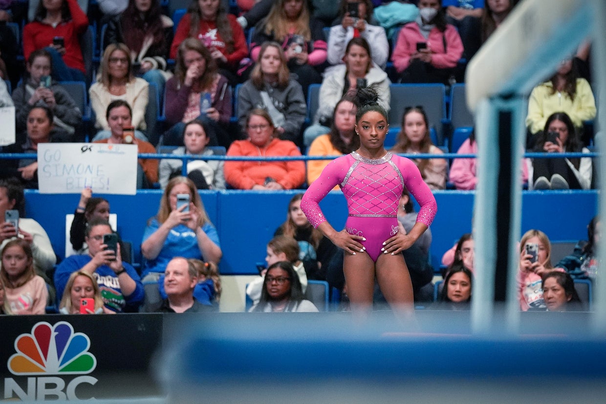 Gabby Douglas falters, Simone Biles shines at Olympic qualifying event ...