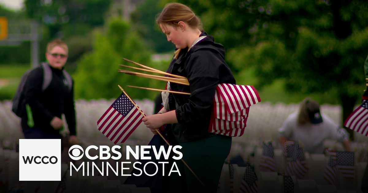 Family places flags at Fort Snelling as Memorial Day tradition - CBS ...